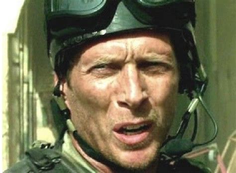 A Close Up Of A Person Wearing A Helmet And Goggles
