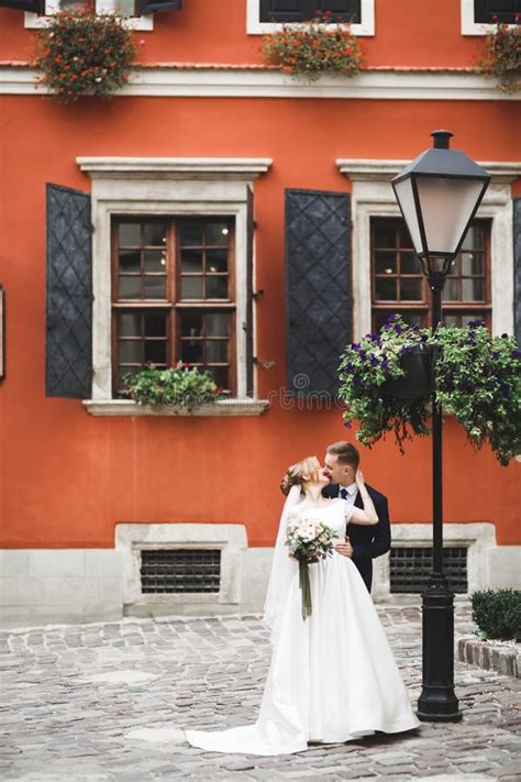 Perfect Couple Bride Groom Posing And Kissing In Their Wedding Day