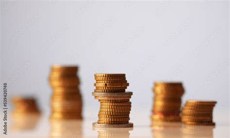 Coin Tower Made Of European Currency Against White Grey Background