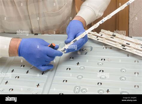 LCD TV Repair Engineer Assembles LED Board With Lamps For Large Tv Panel Stock Photo Alamy
