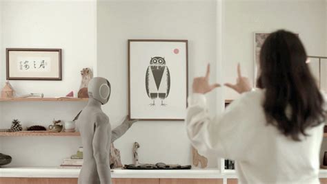 Scandi Robot Servant Neo Gamma Is Dressed Head To Toe In Beige Knitwear
