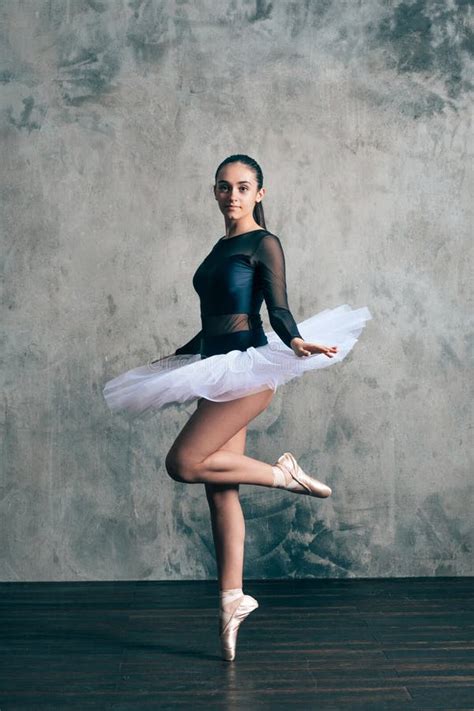 Graceful Young Ballerina In Pointe Shoes Standing On Tiptoes Stock