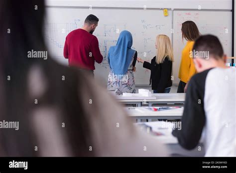 Female Architecture Teacher At Work Female Professor Explain Architectural Projects To Babes