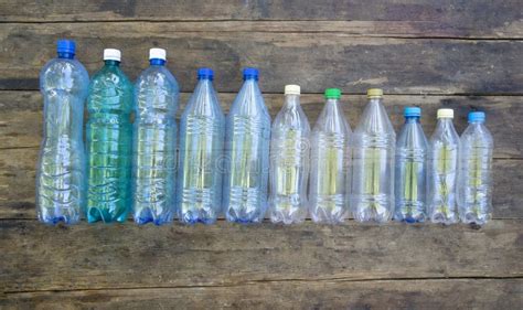 Many Empty Plastic Bottles Lie On The Wooden Floor Stock Image Image