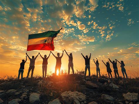 Silhouettes Of People On Sunset Holding Flag Stock Image Image Of