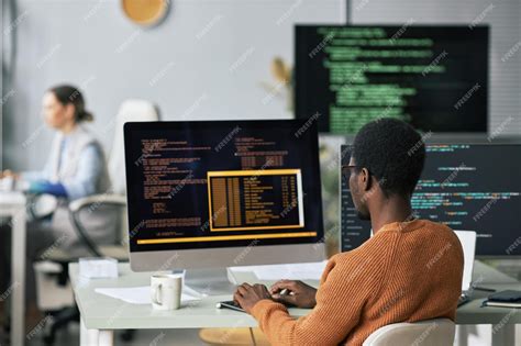 Premium Photo Young Black Man Testing Programming Code He Wrote For