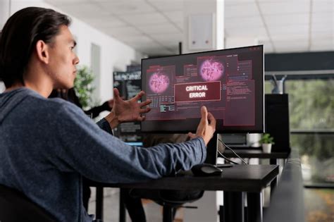 Premium Photo Nervous App Developer Having System Error Message On Computer Screen Trying To