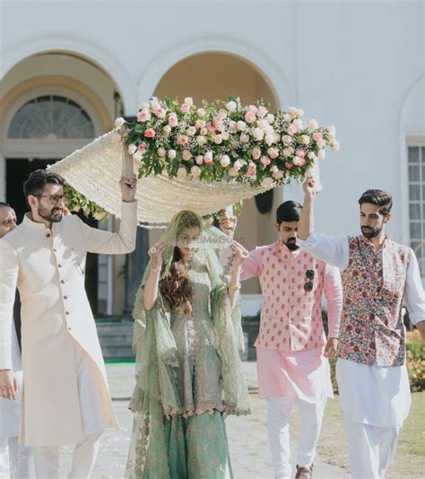 Photo Of White Bridal Entry Chadar With Floral Decoration