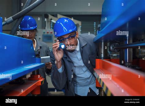 Engineers Check Control Heavy Machinery In Industrial Factory For