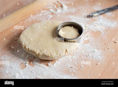 Scone Mixture Rolled Out On The Worktop With Circular Utensil To Cut