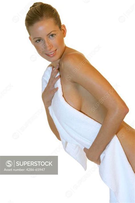 Naked Woman Covers Herself With Towel Superstock