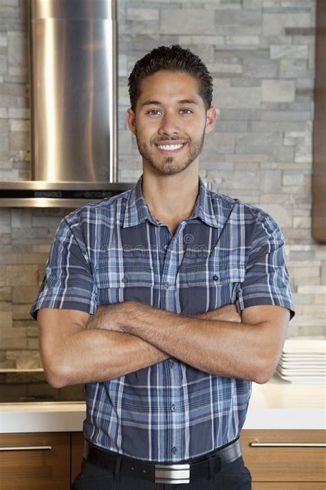 Midsection Of Man Standing Near Oranges Stall With Vegetable Basket In Supermarket Stock Image