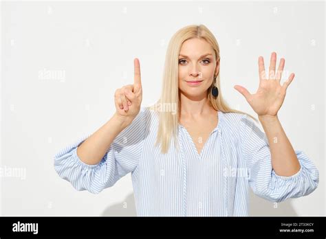 Attractive Blonde Woman Shows Six Fingers Counting With Fingers Stock