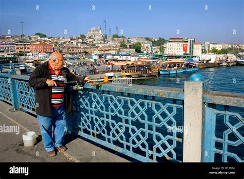 Fisherman On The Galata Bridge At Istanbul Stock Photo Alamy