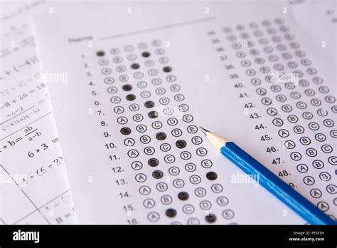 Pencil On Answer Sheets Or Standardized Test Form With Answers Bubbled