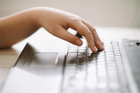Premium Photo Closeup Of Male Hands Typing On Laptop Keyboard Indoors