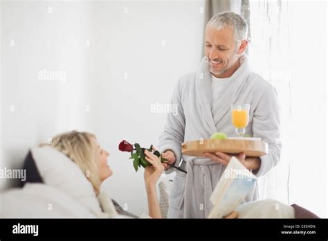 Man Bringing Wife Breakfast In Bed Stock Photo Alamy