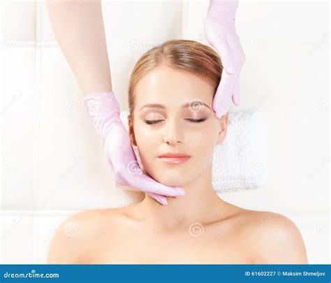 Portrait Of Beautiful Woman And The Healer Hands In Gloves Stock Image