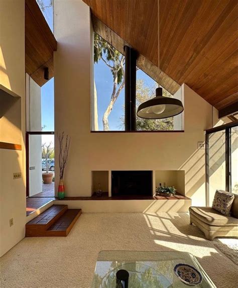 Modern Open Living Room Design With High Ceilings And Large Windows