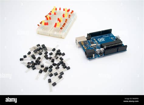 Arduino Wires And Around Transistors Lined Up On A White Background