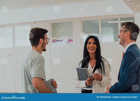 The Director Conducts A Conversation With The Secretary And A Young