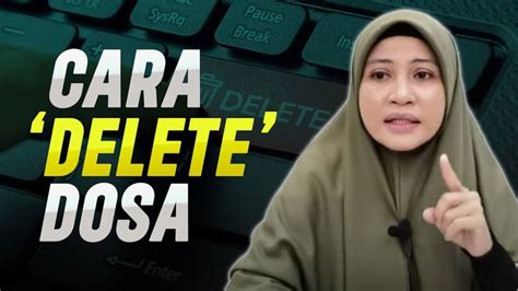 A Woman Wearing A Hijab Pointing At The Camera With Her Finger Up In