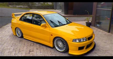Modified Mitsubishi Lancer In Yellow Shade Looks Neat Modified Mitsubishi Lancer In Yellow Shade Looks Neat