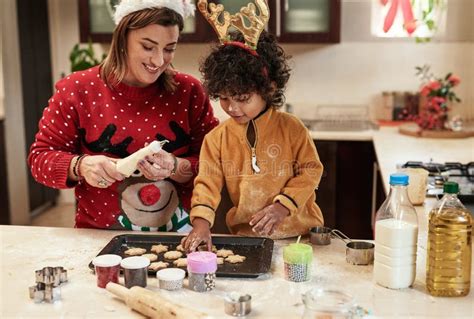 This Is The Finishing Touch A Cheerful Young Woman And Her Son Baking