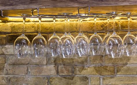 Rows Of Empty Wine Glasses On The Bar Counter In The Restaurant Or Bar