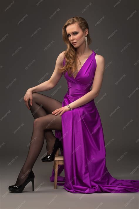 Premium Photo Sexy Girl In Evening Dress Posing Over Dark Background