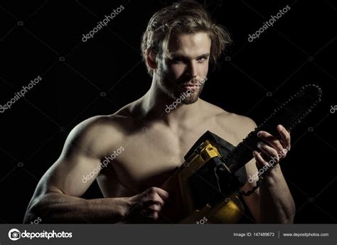 Sexy Man With Electrical Saw Naked Man With A Chainsaw On A Black Background Stock Photo By