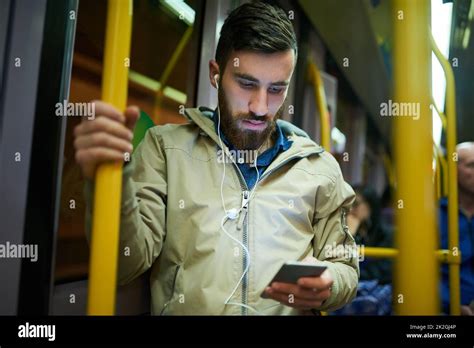 On The Bus With A Few Good Tunes Cropped Shot Of A Handsome Young Man