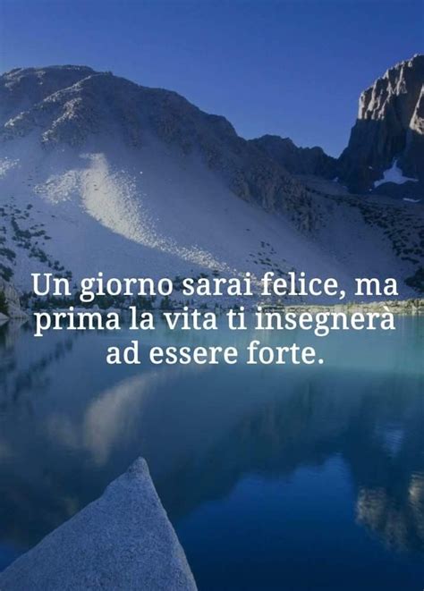 A Lake With Mountains In The Background That Says Un Giorno Sara