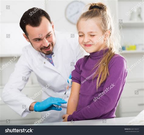 Male Doctor Using Syringe Make InjectionẢnh có sẵn684140257 Shutterstock