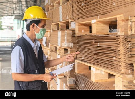 Worker Checking Raw Material Inventory In Factory Stock Photo Alamy
