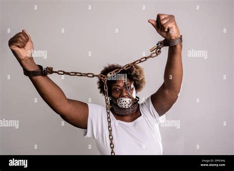 Portrait Of A Woman Trapped With Old Rusty Chains And Mask On Her Face