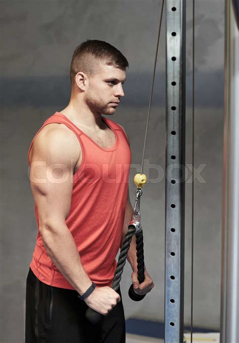 Man Flexing Muscles On Cable Machine Gym Stock Image Colourbox