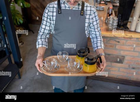 Bartender Serving Citrus Drinks At A Bar Stock Photo Alamy