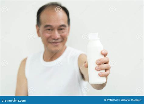 Asian Man Holding Bottle Of Milk Stock Image Image Of Lifestyle