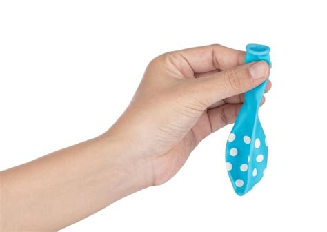 Premium Photo Hand Holding Deflated Balloon Isolated On White Background