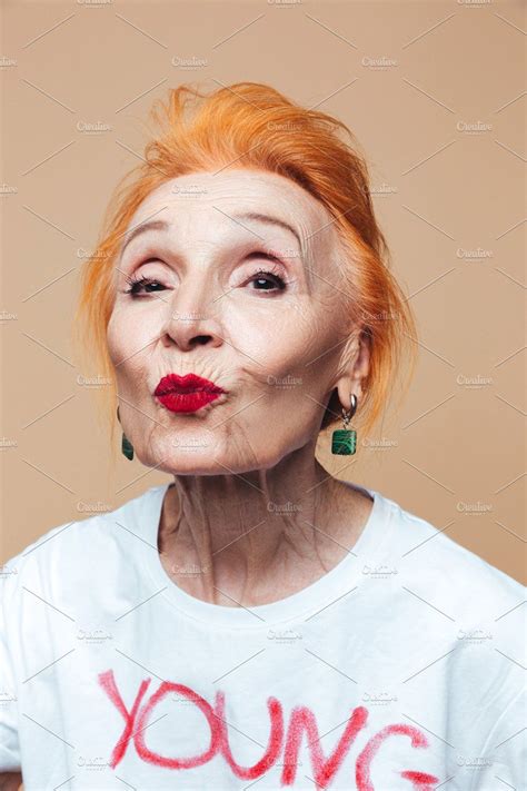 Mature Redhead Fashion Woman Blowing Kisses By Royalty Free Images On Creativemarket Mature