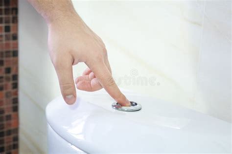 Finger Pushing A Flush Toilet Button For Cleaning Full Discharge Button Stock Photo Image Of
