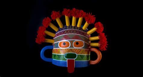 A Colorful Mask Is Hanging On The Wall