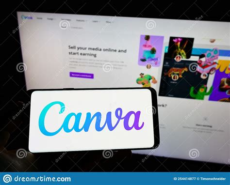 Person Holding Mobile Phone With Logo Of Australian Graphic Design