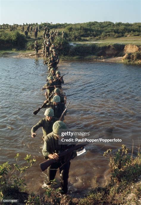 A Company Of 200 United States Marine Corps Infantrymen Crossing A