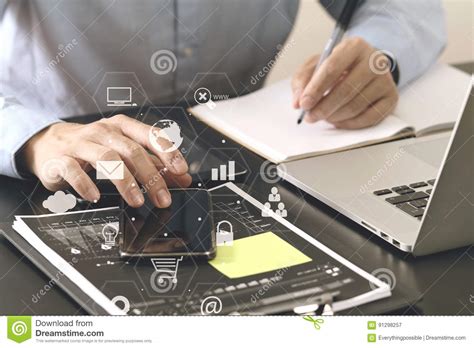 Close Up Of Businessman Working With Smart Phone And Digital Tab Stock