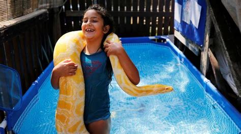 Watch 8 Year Old Girl Swims With 11 Foot Python Her Best Friend