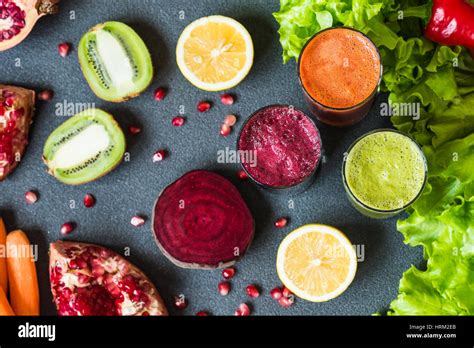 Three Glasses Of Different Fresh Juice Beet Carrot And Kiwi Juices On