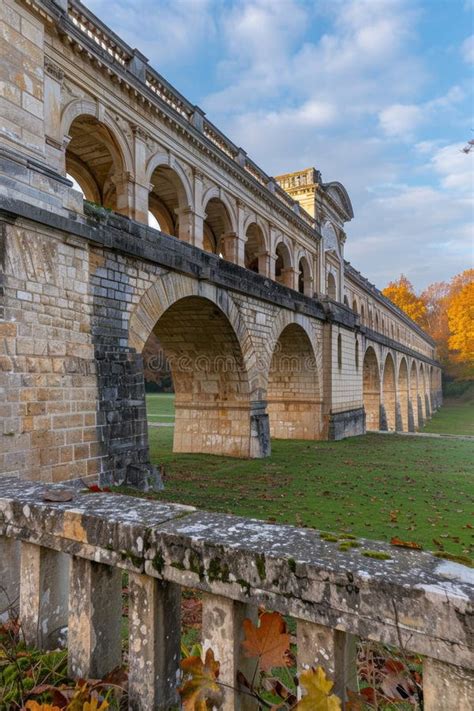 Historic Aqueduct In Autumn Surrounded By Colorful Foliage Showcasing