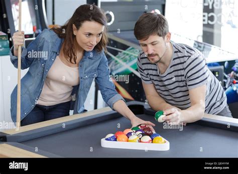 Couple Setting Up Balls For A Pool Game Stock Photo Alamy